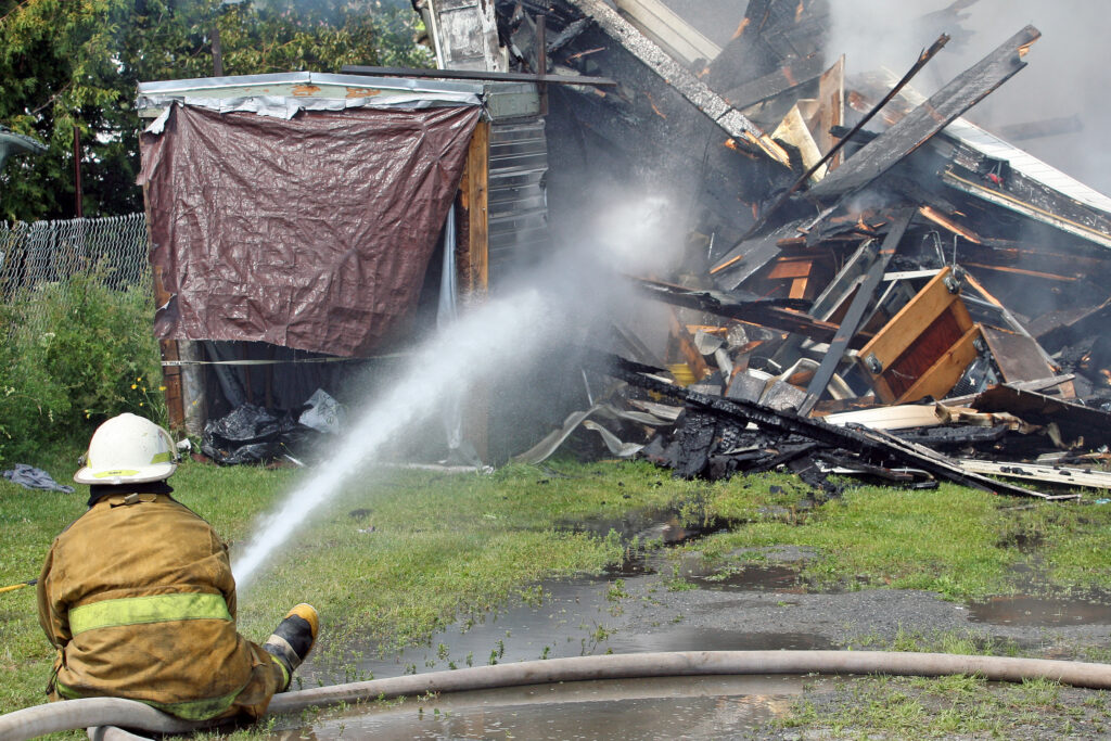 Firefighters extinguish Oakfield garage fire, save house - The County