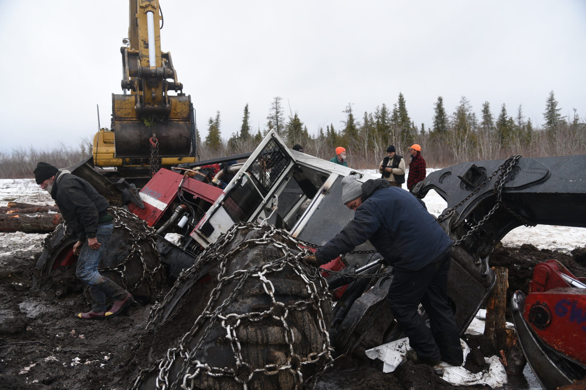 Workers remove logging vehicle from Portage Lake - The County